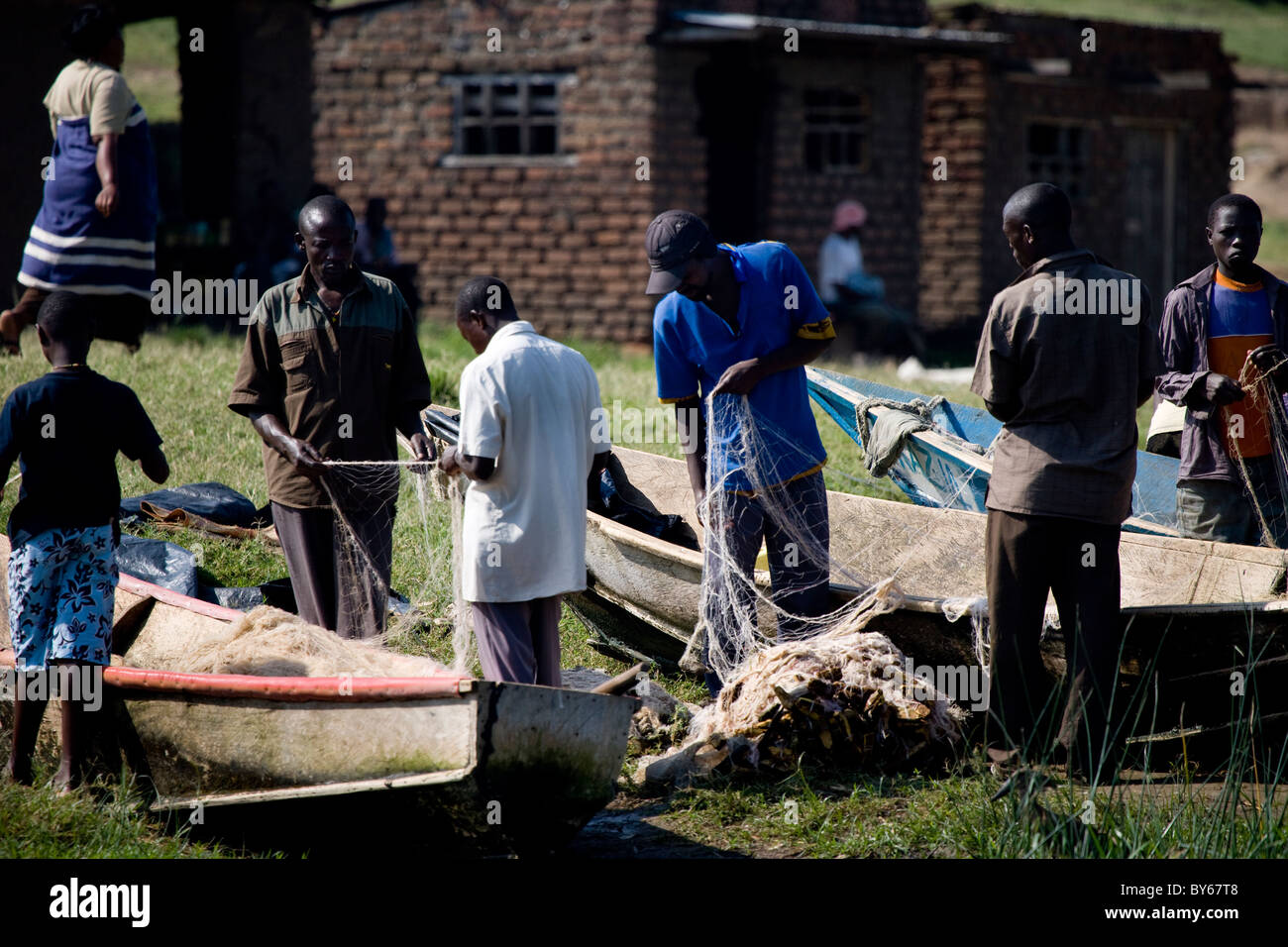 Fishermen preparing nets, Kasinga Channel, Uganda, East Africa Stock ...