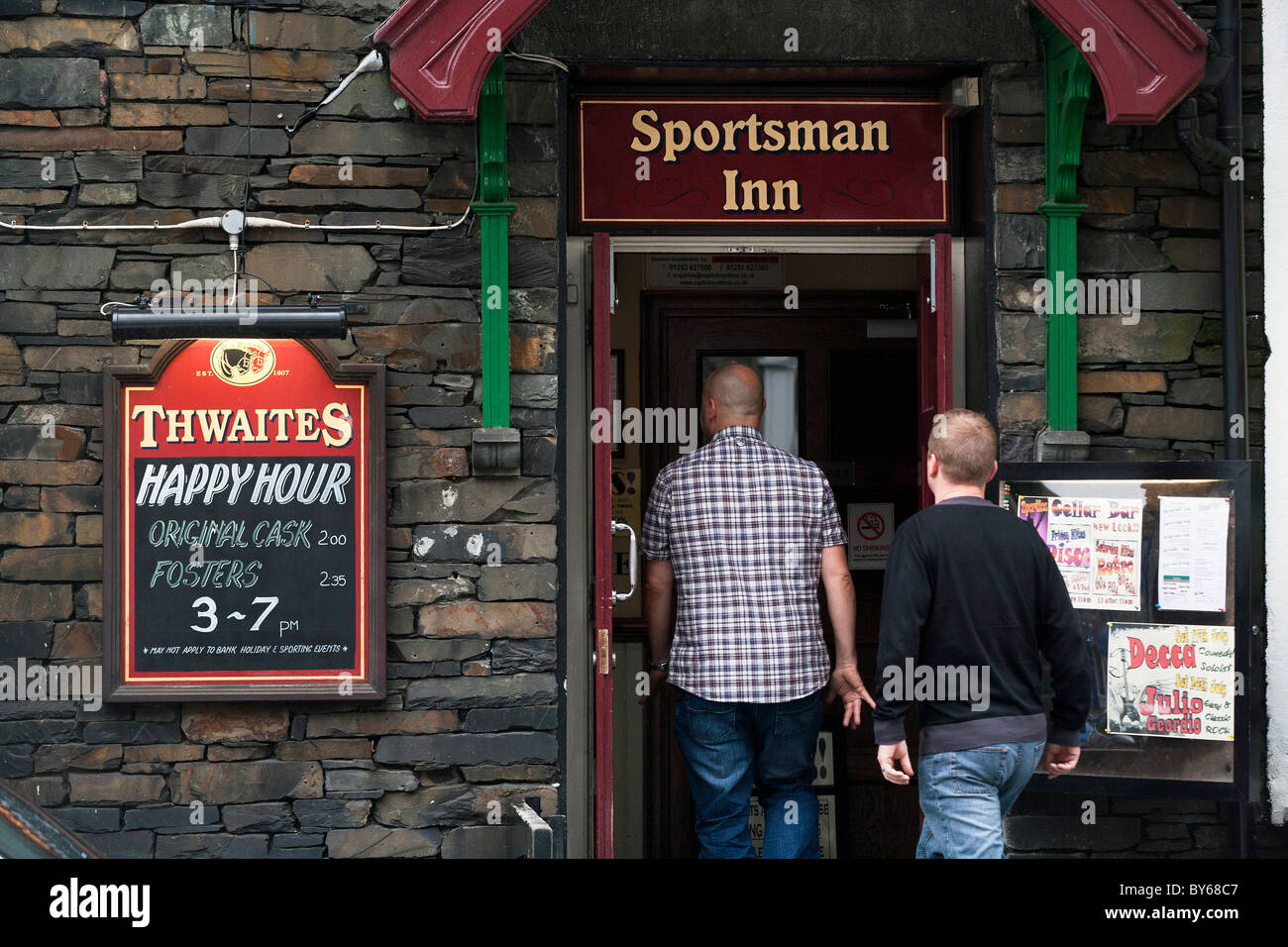 Two men walk into a pub for happy hour in the small Lake Disrict ...