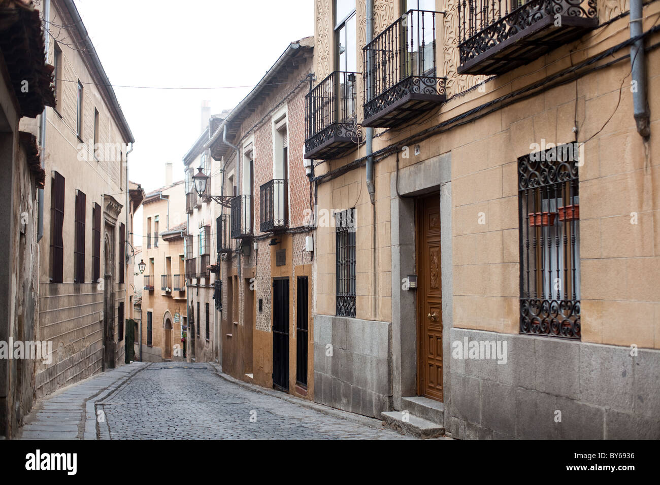Cobblestone street in historic Segovia, Spain Stock Photo - Alamy