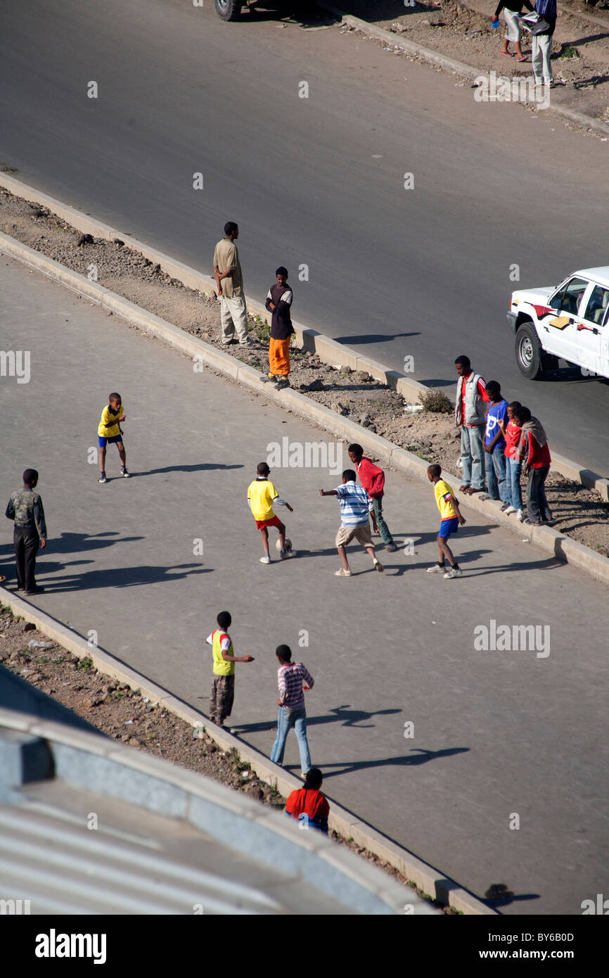 Overhead of children playing football in the streets of Addis Ababa ...