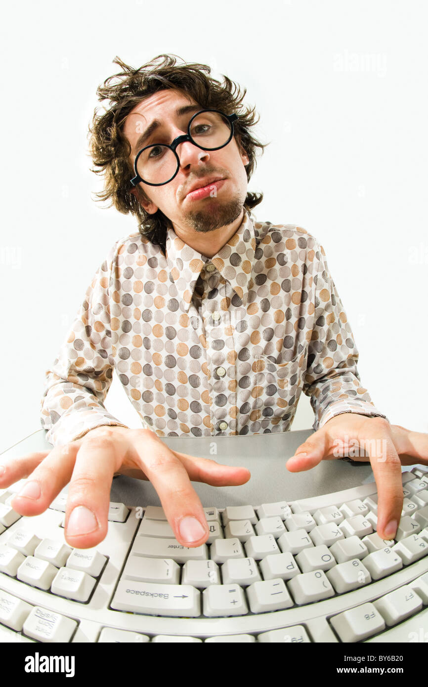 Portrait of tired man typing on the computer keyboard Stock Photo - Alamy