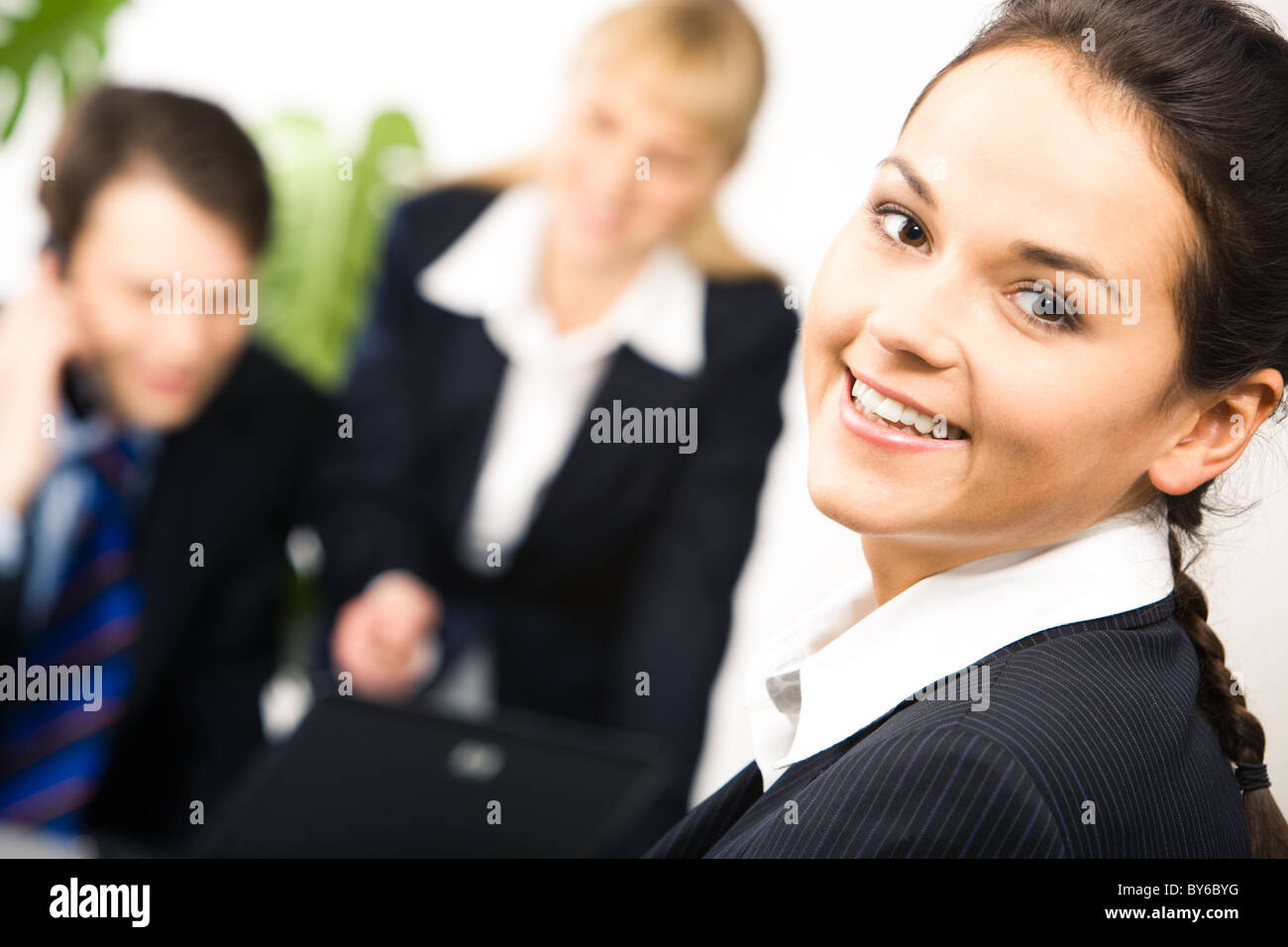 Photo of businesswoman looking at camera during work Stock Photo - Alamy