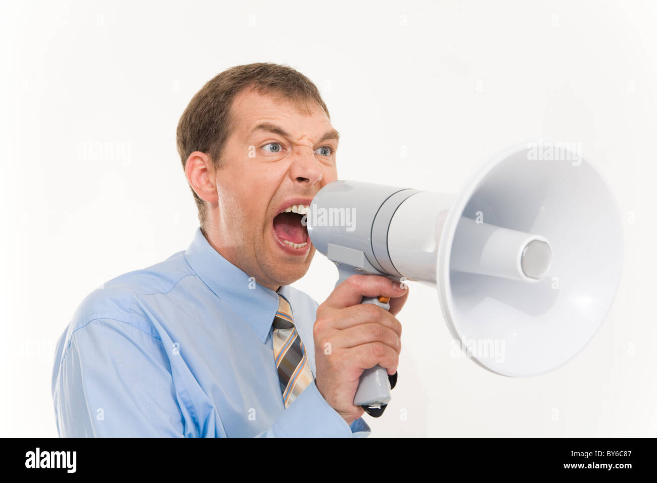 Photo of businessman with megaphone in hand screaming into it Stock ...