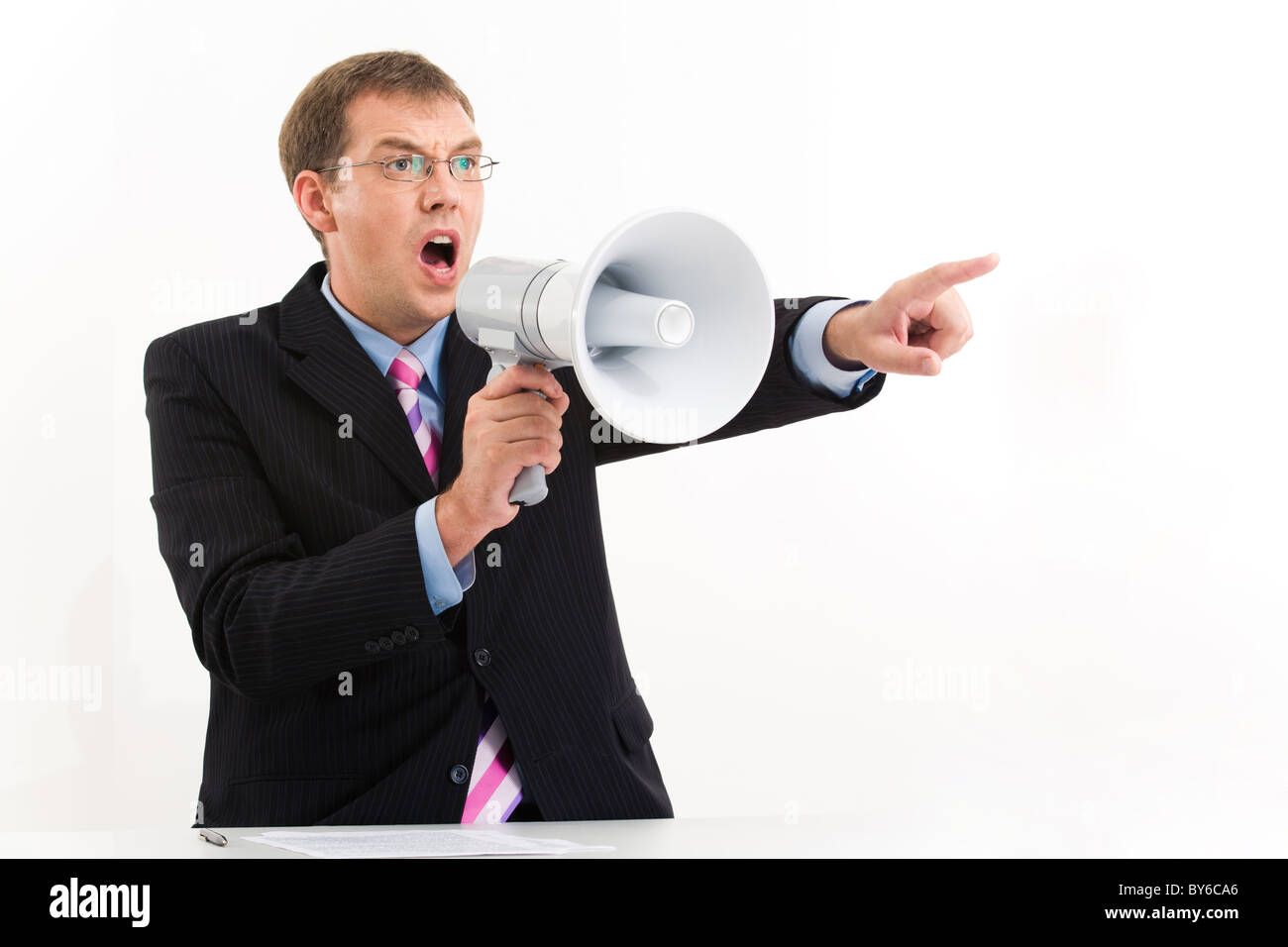 Photo of businessman with megaphone in hand screaming into it Stock ...