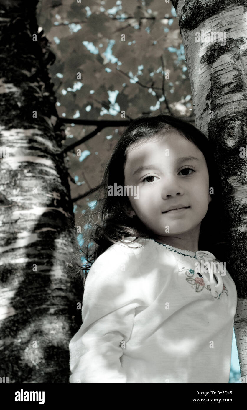 Girl in a tree Stock Photo - Alamy