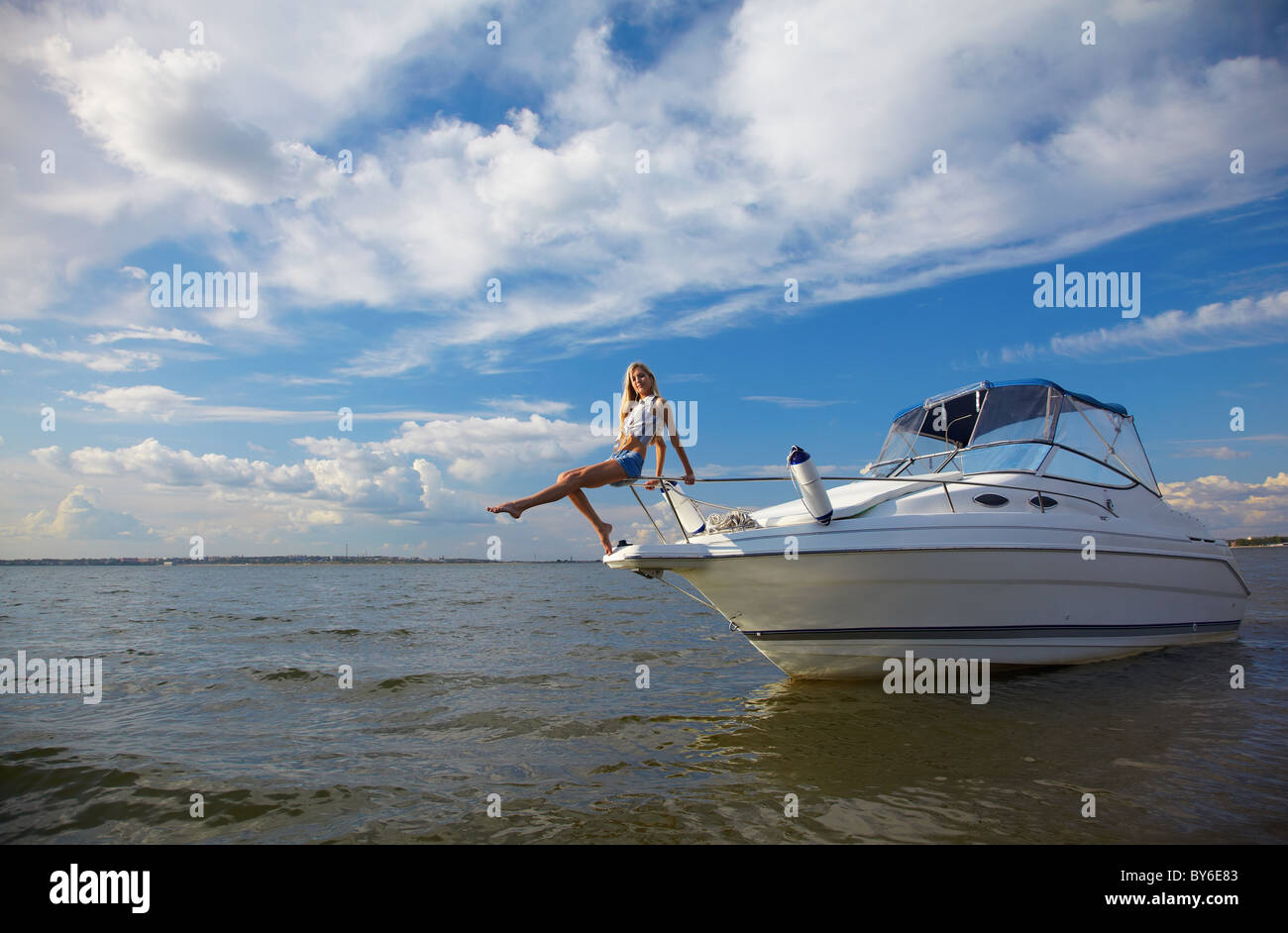 balancing on yacht's stem Stock Photo - Alamy