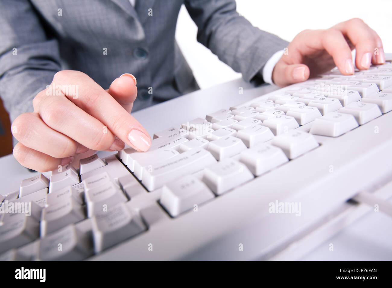 Image of secretary’s hands while pressing enter button during computer ...