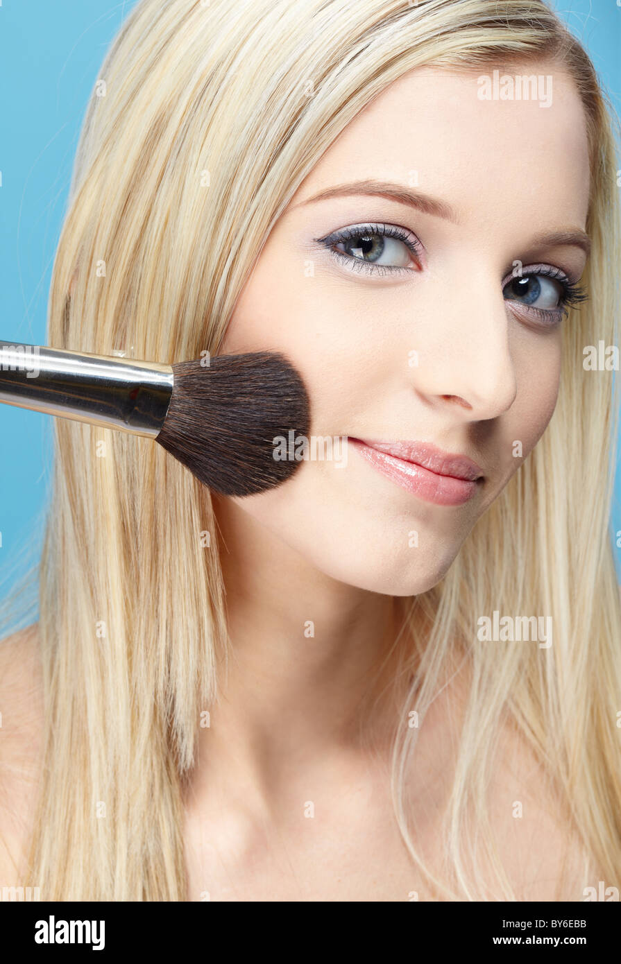 blonde girl making up Stock Photo - Alamy