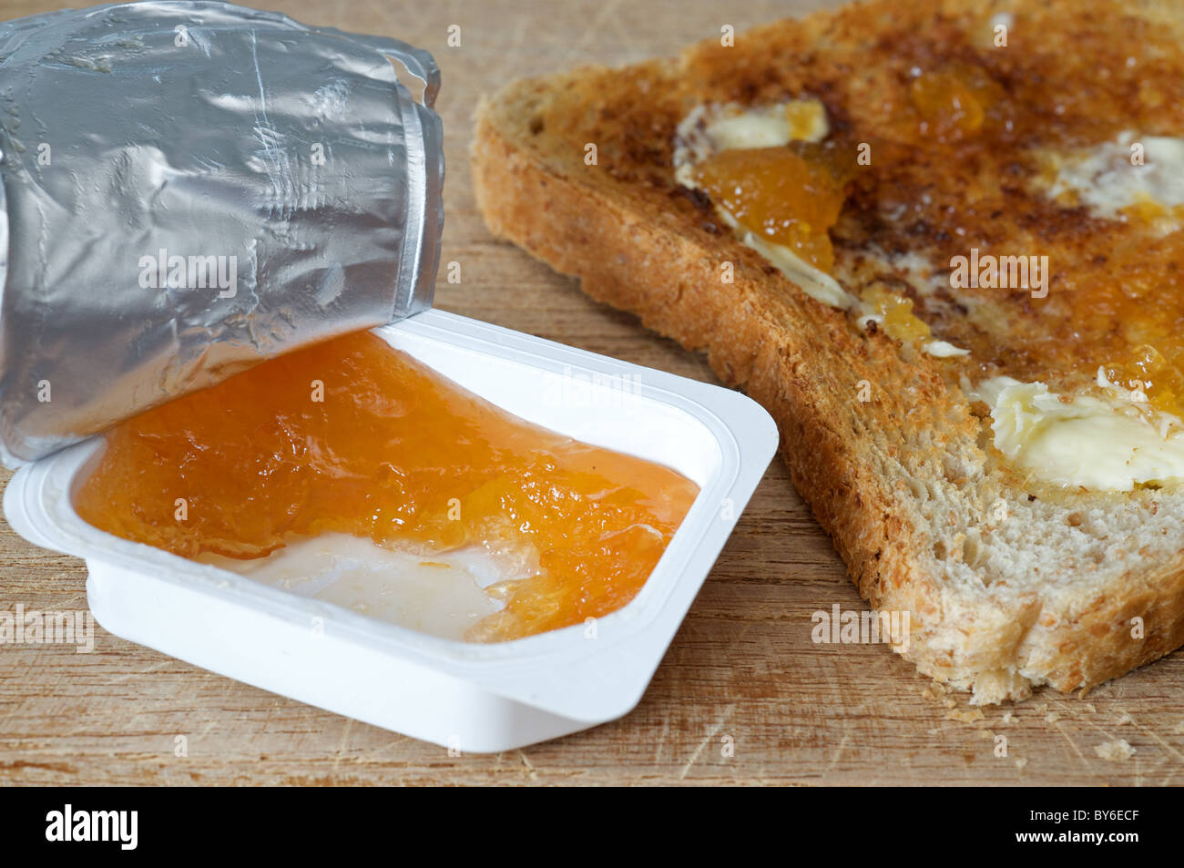 Individual portion of apricot jam and toast Stock Photo - Alamy