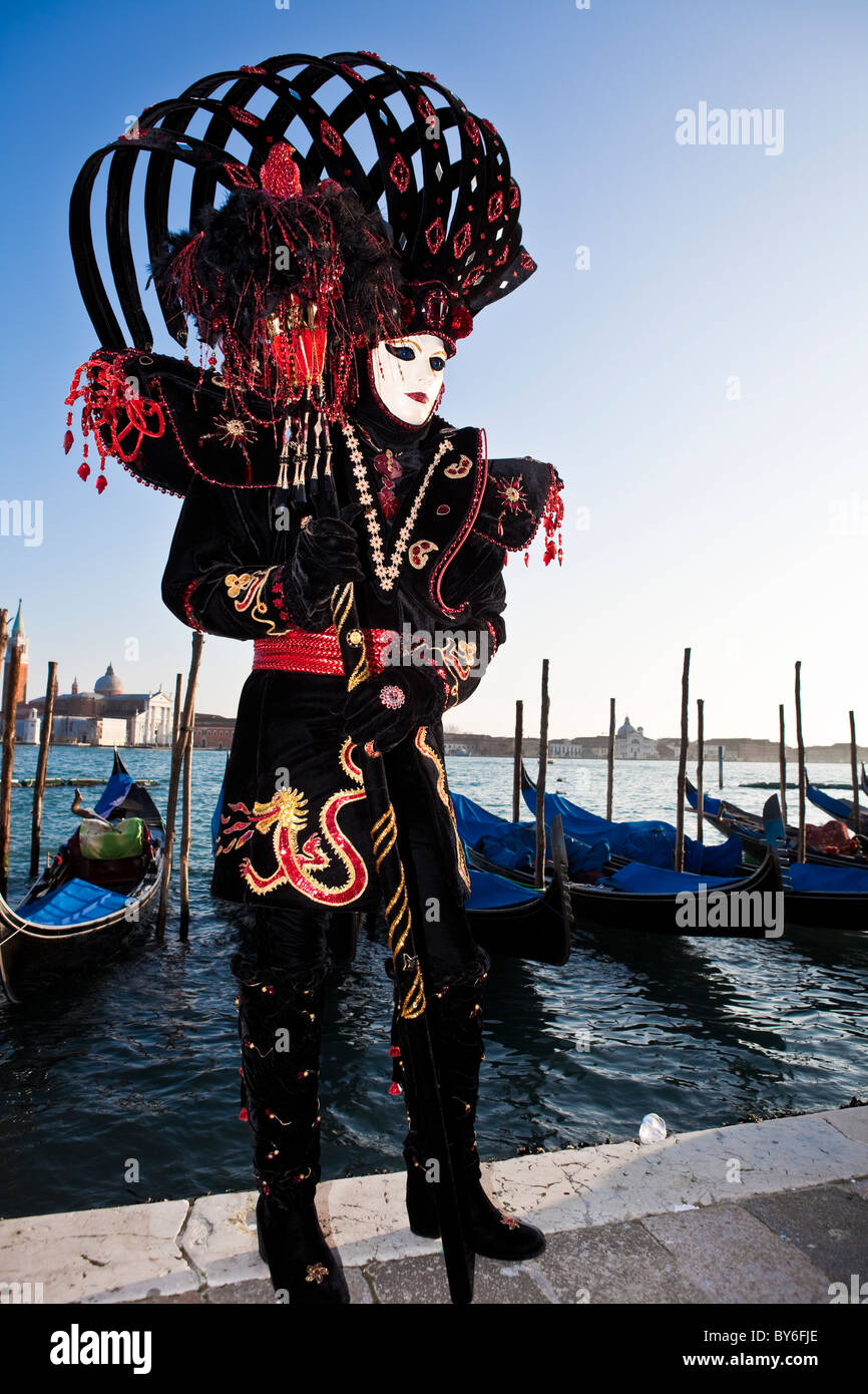 Red and black Venice Carnival costume Stock Photo - Alamy