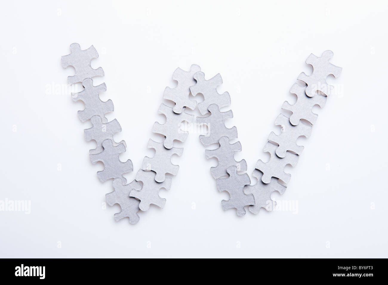 W letter made by puzzle pieces Stock Photo - Alamy