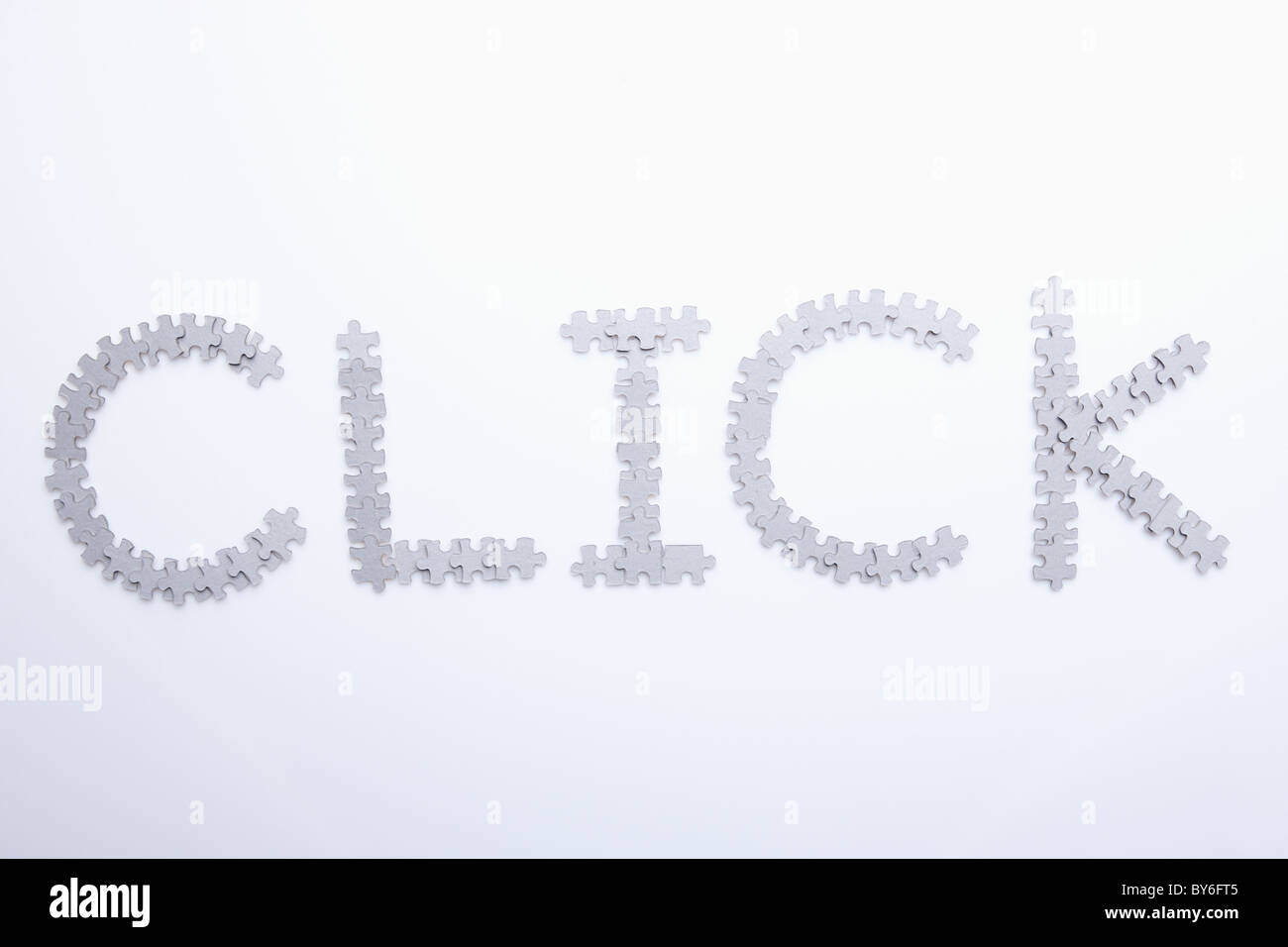 CLICK words made by puzzle pieces Stock Photo - Alamy