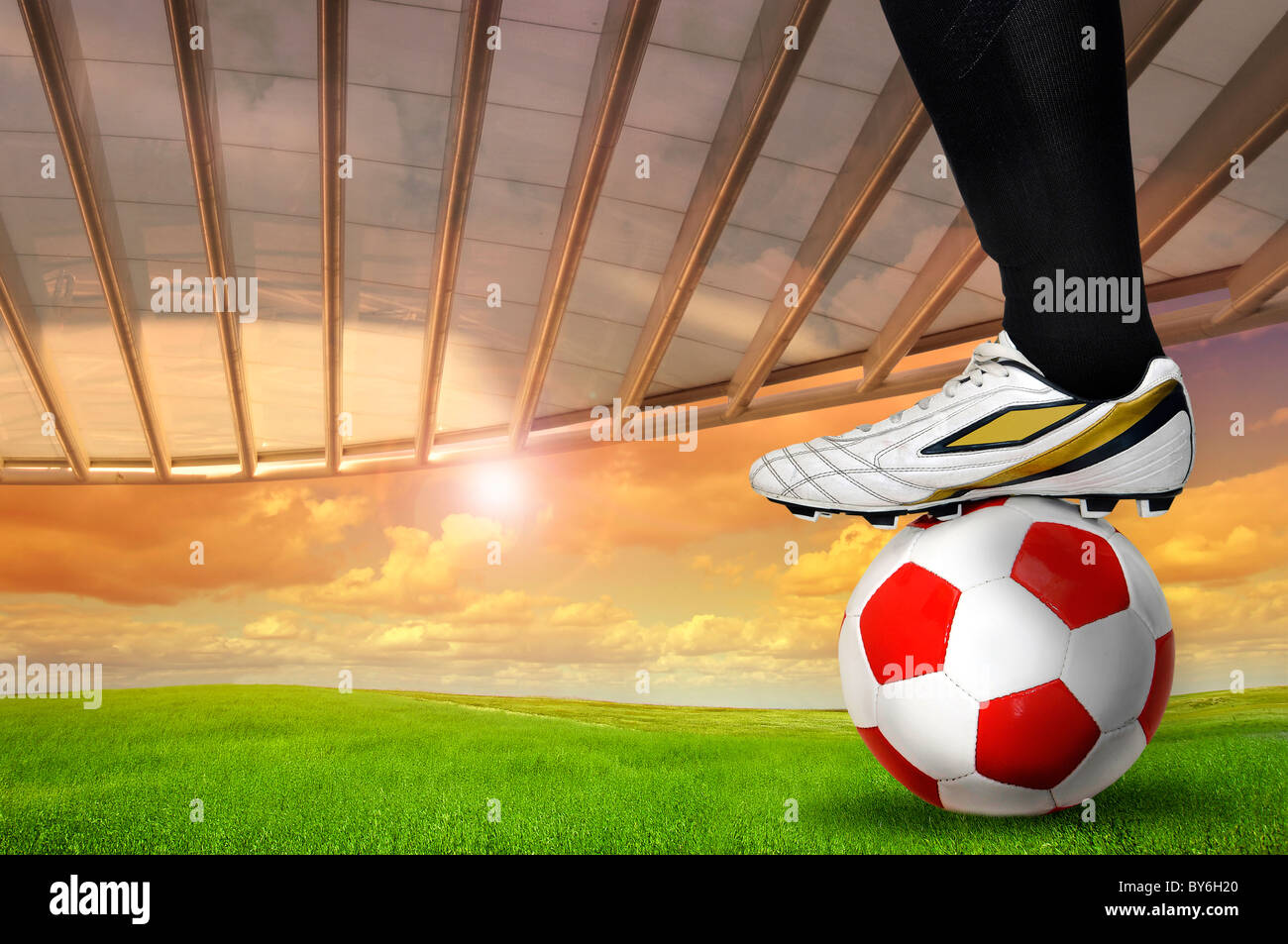 Soccer background with a players foot over a ball outdoors Stock Photo ...