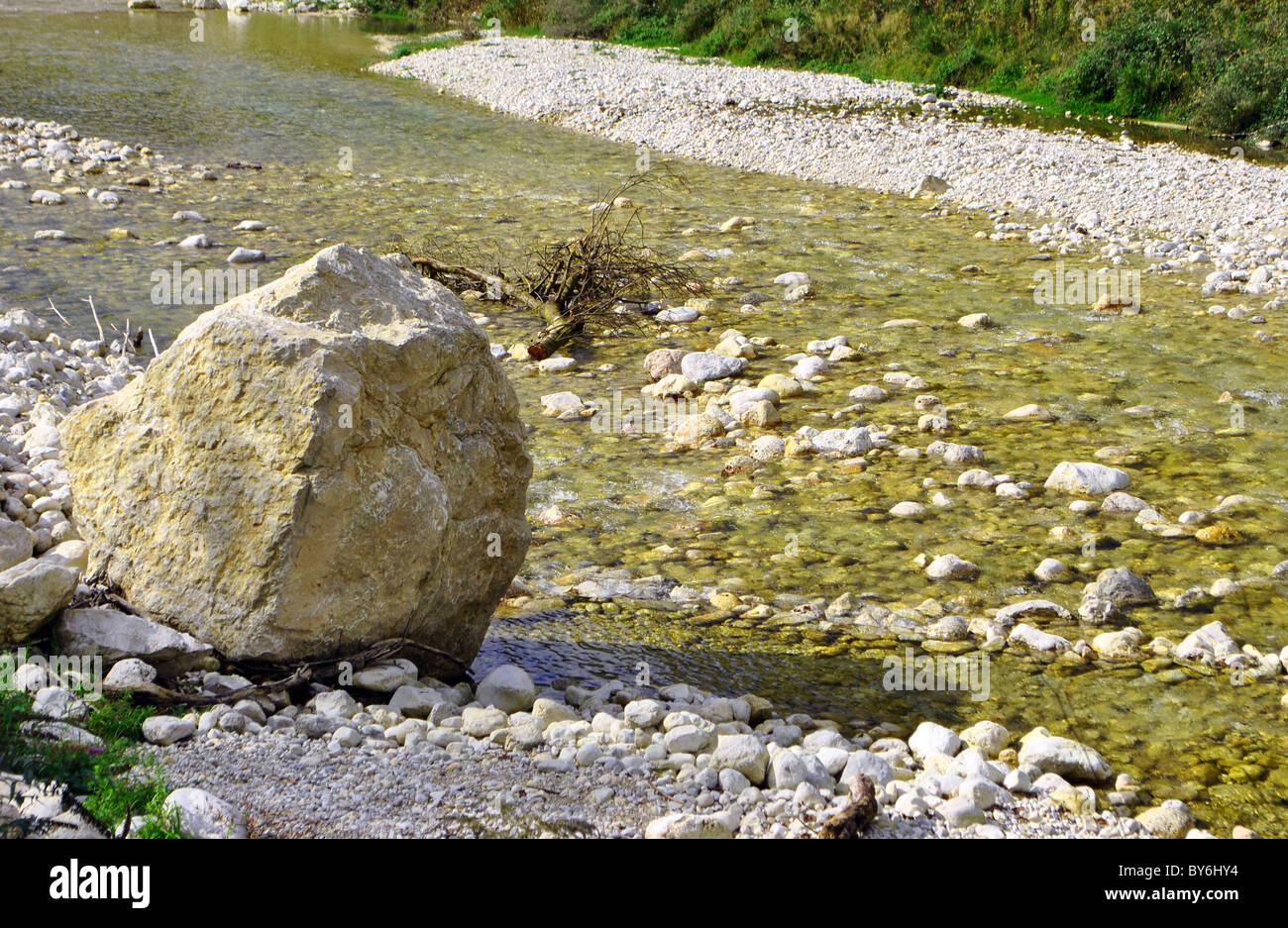 river with big rock on the shore Stock Photo - Alamy
