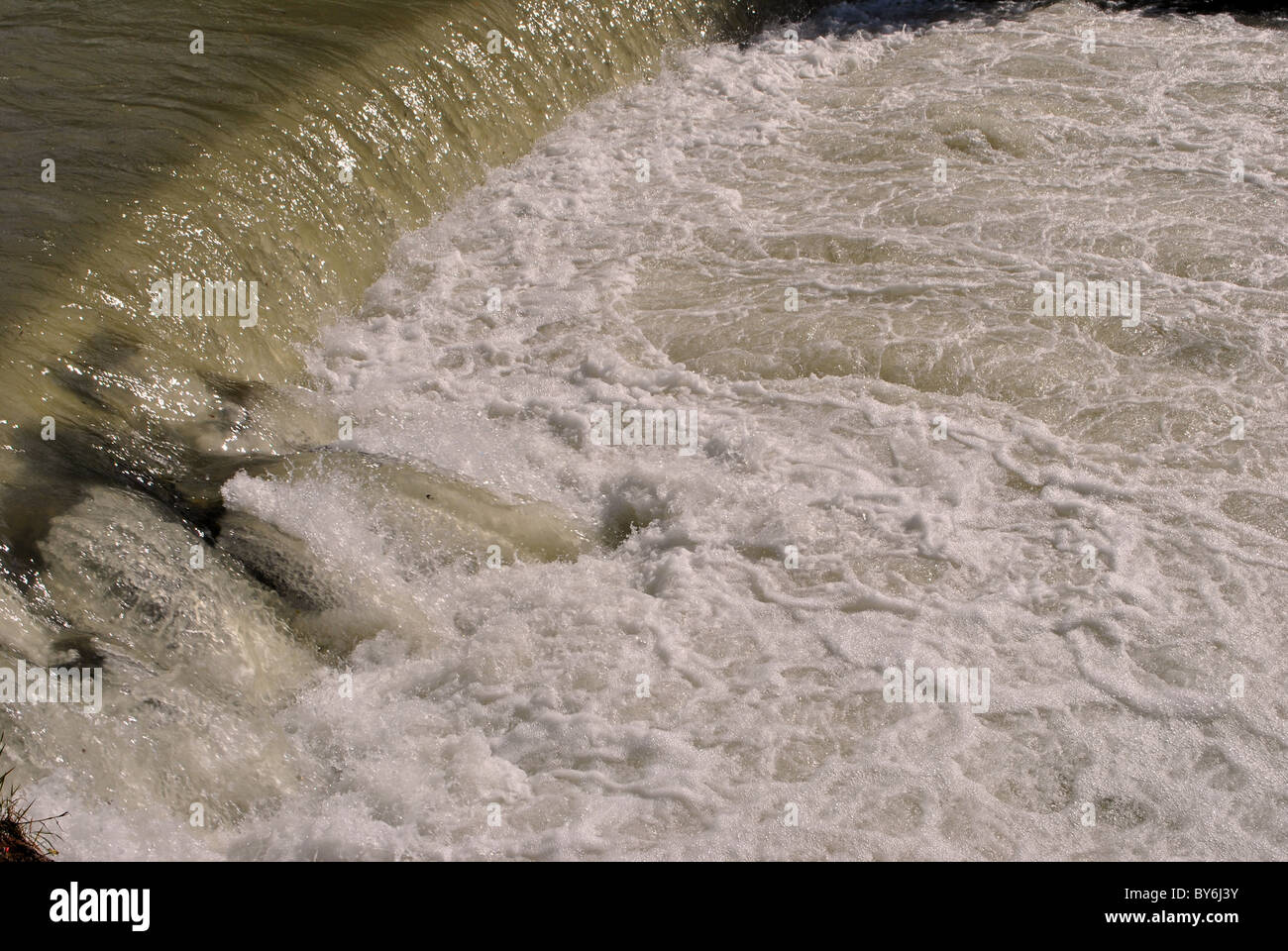 waterfall and stream with strong current of water Stock Photo - Alamy