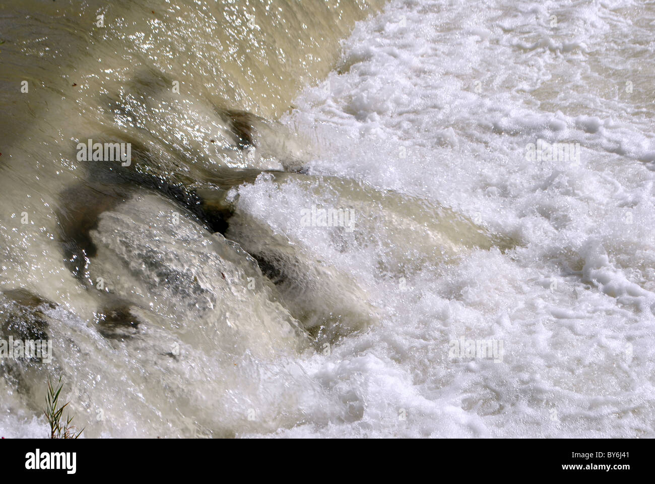 waterfall and stream with strong current of water Stock Photo - Alamy
