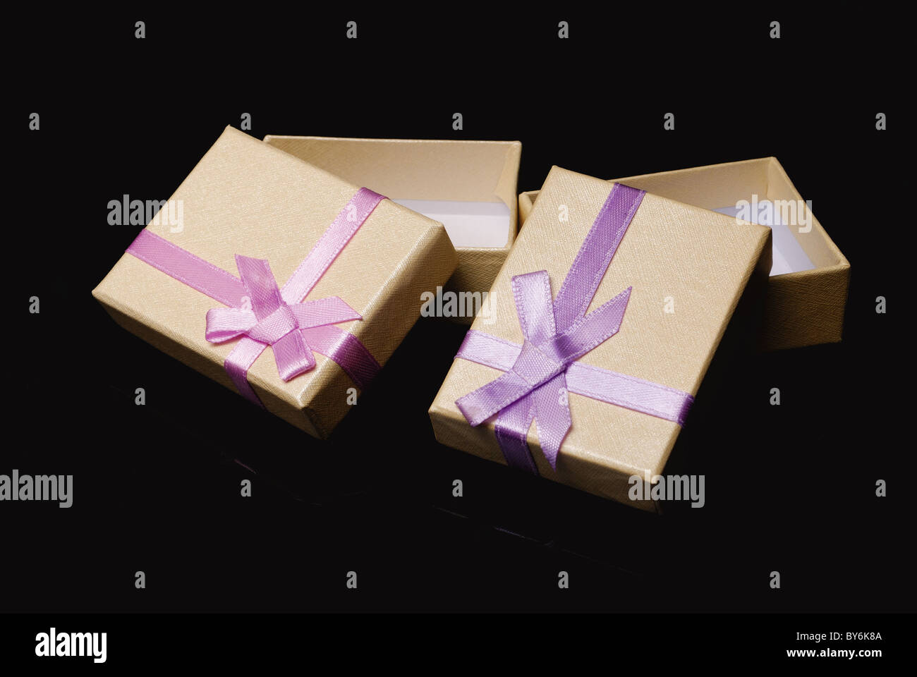 two gift boxes on black Stock Photo - Alamy