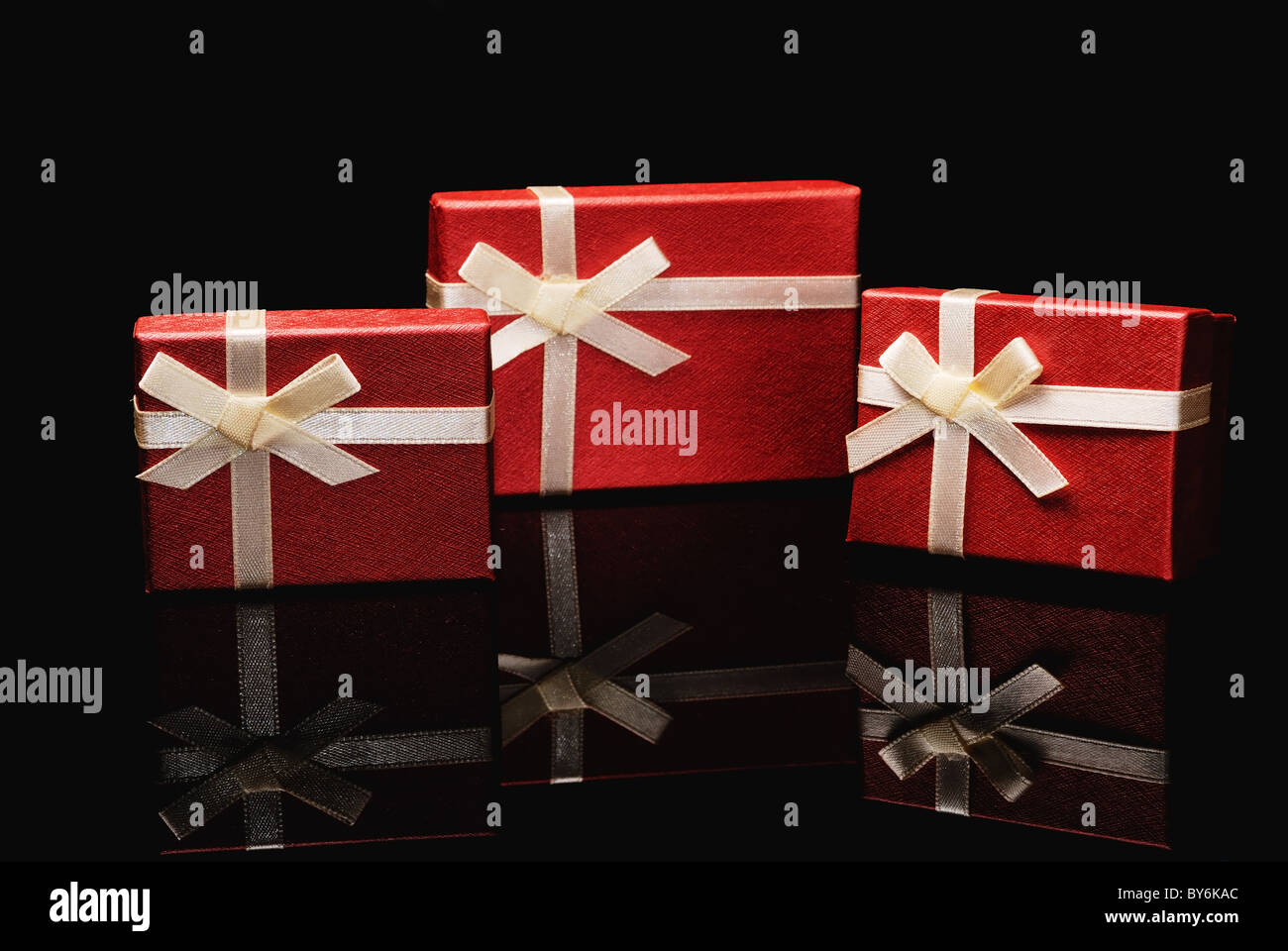 red gift boxes on black Stock Photo - Alamy