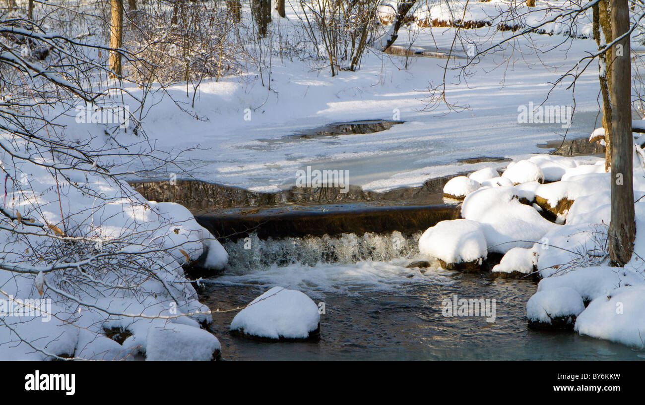 A river stream dam in a snowy winter scene Stock Photo - Alamy