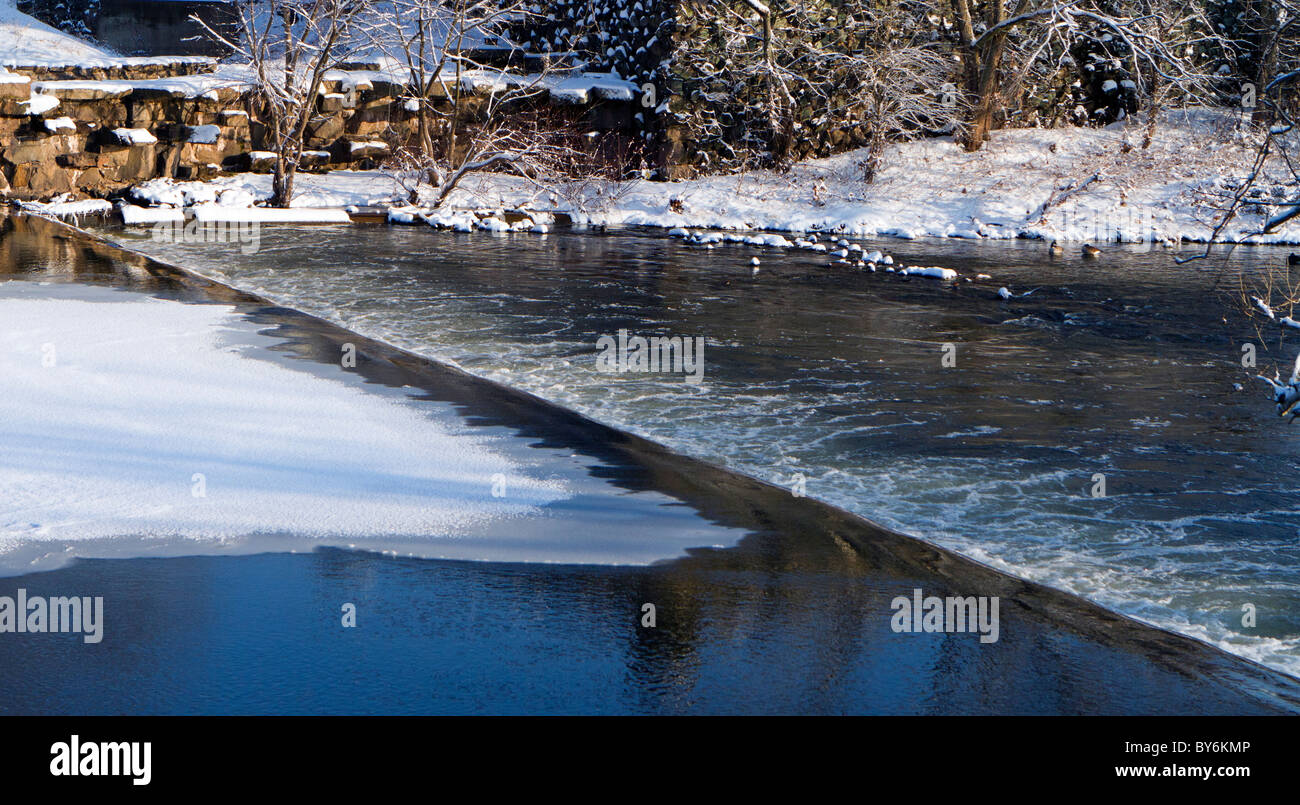 A river stream dam in a snowy winter scene Stock Photo - Alamy