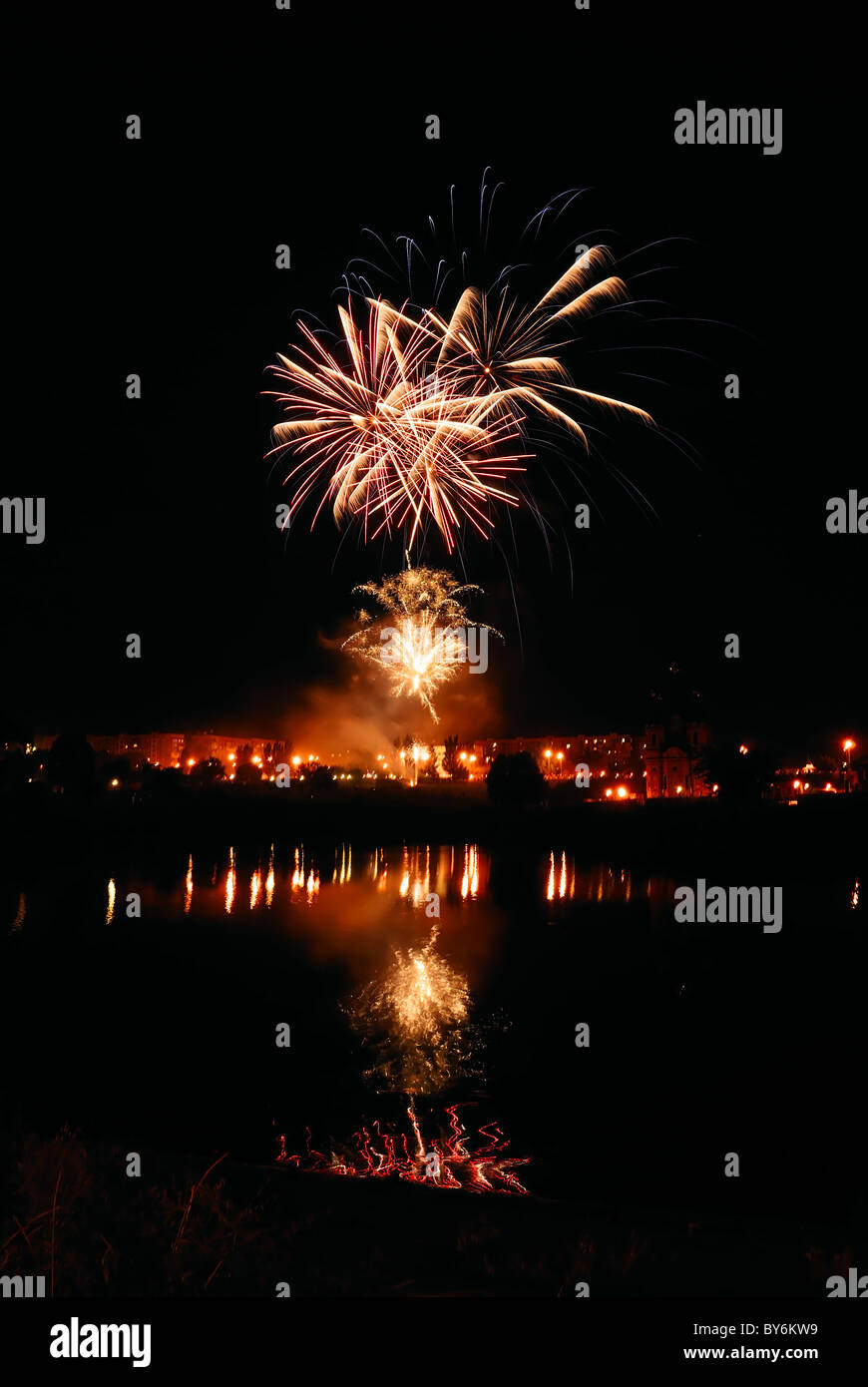 night traditional firework with reflection in water Stock Photo - Alamy