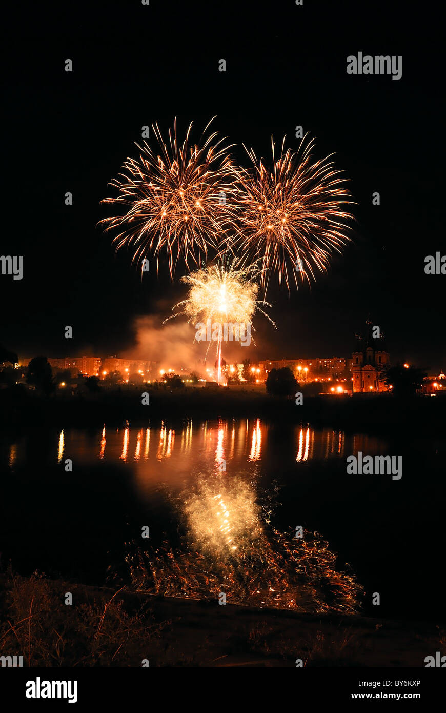 night traditional firework with reflection in water Stock Photo - Alamy