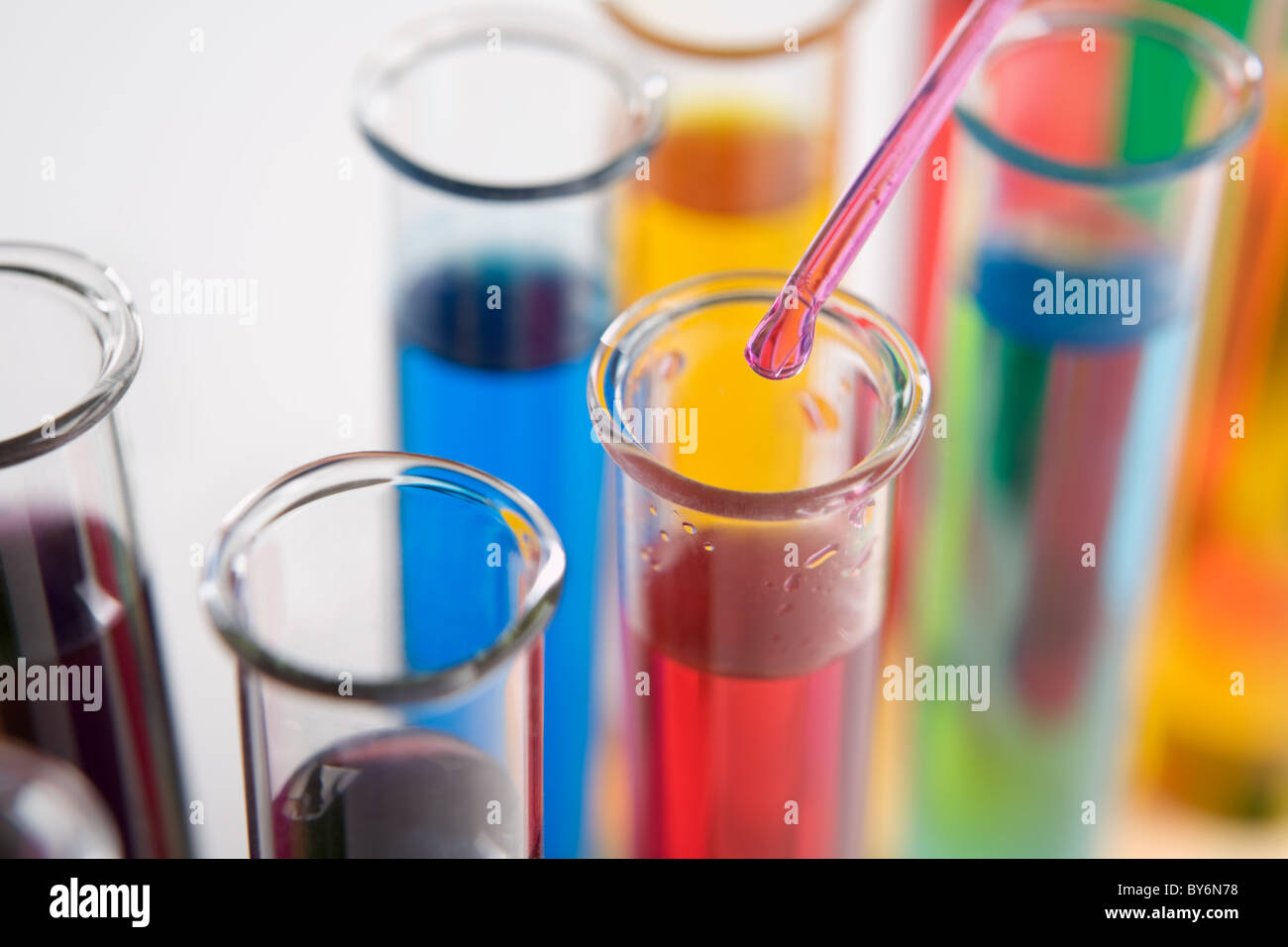 Drop chemical solution into test tube, shallow depth of field Stock ...