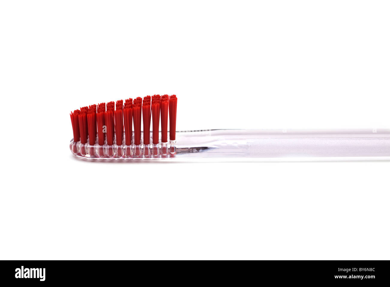 red toothbrush isolated on white background close up Stock Photo - Alamy