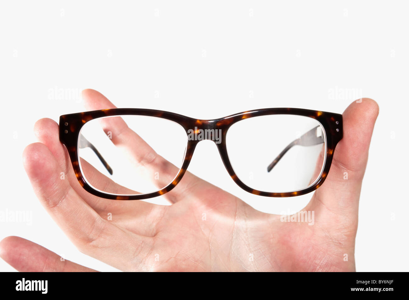 glasses in the hands isolated on white background Stock Photo - Alamy