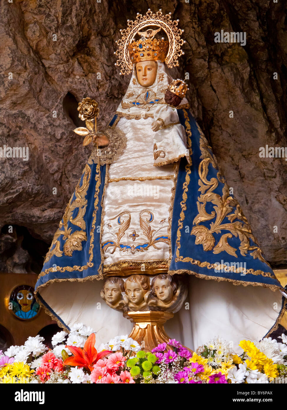 Madonna and child statue in a cave at the 19th century Basilica at ...