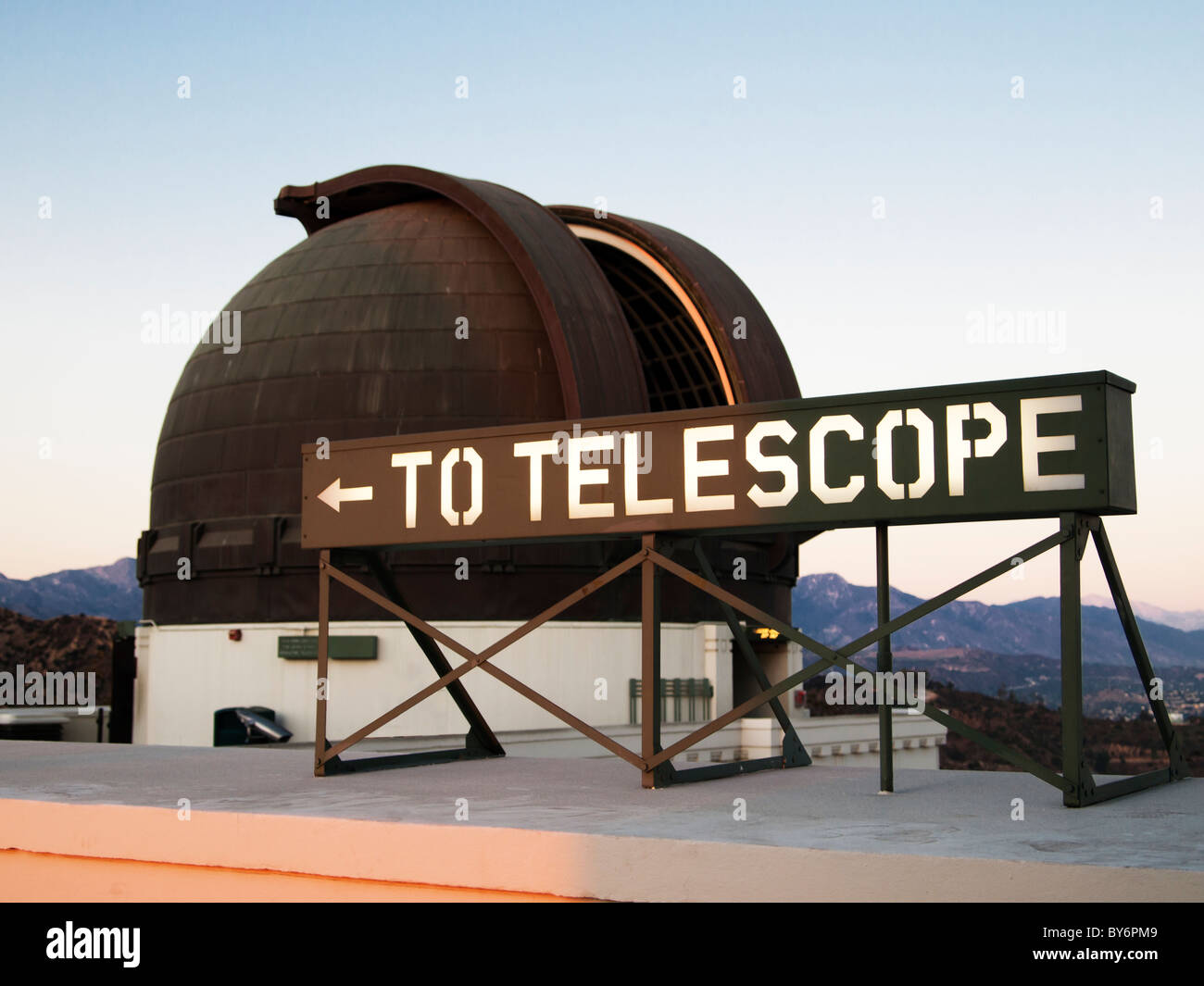 To telescope sign during sunset, at at the Griffith Park Observatory ...