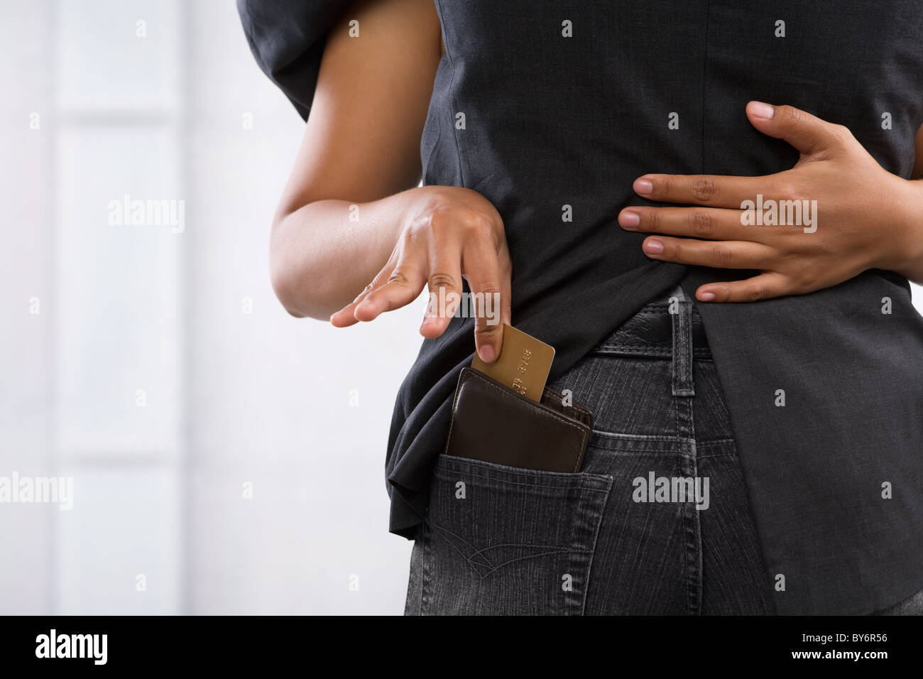 femlae hand pickpocketing gold credit card from businessman's pocket ...