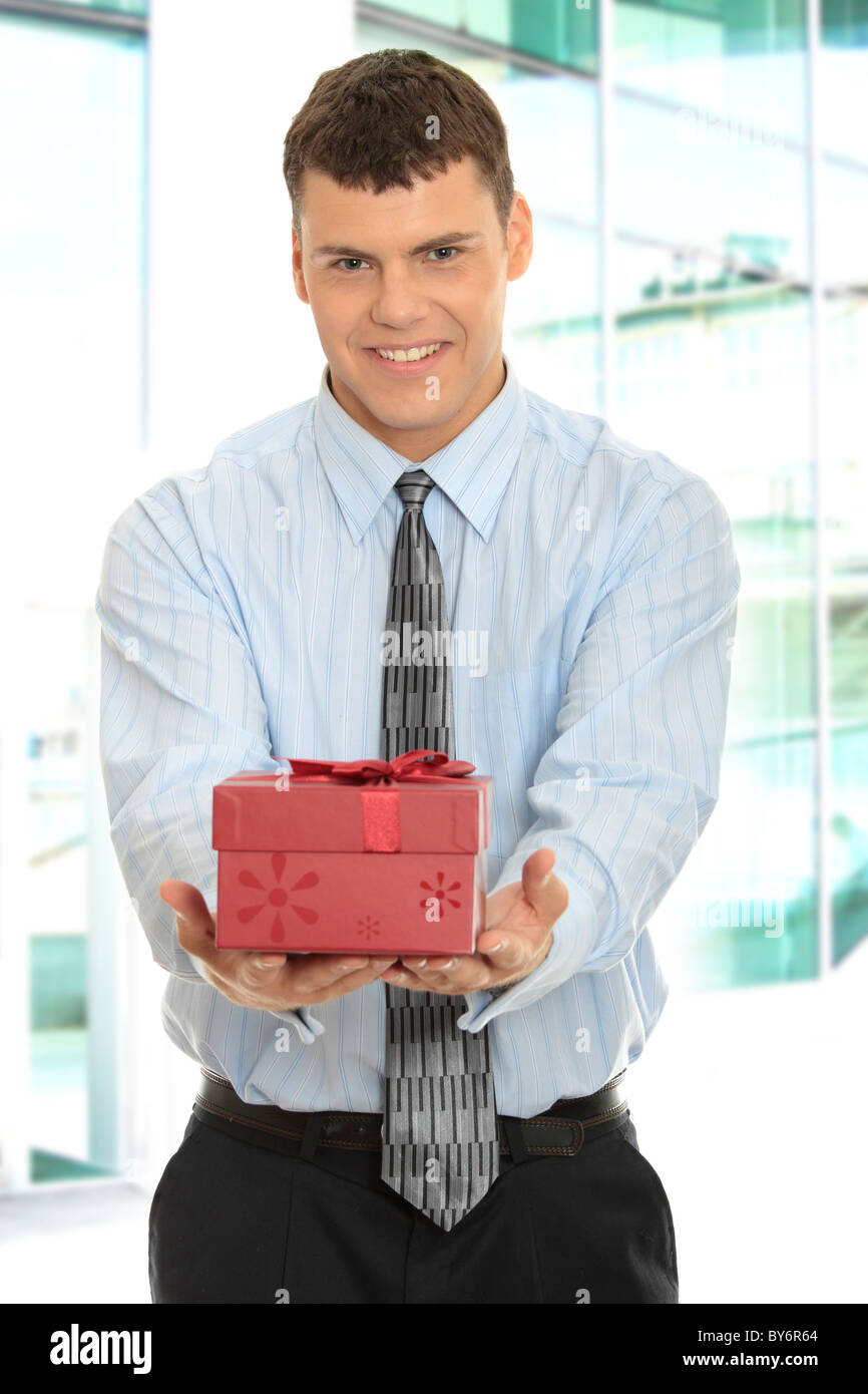 Business man offering a gift Stock Photo - Alamy