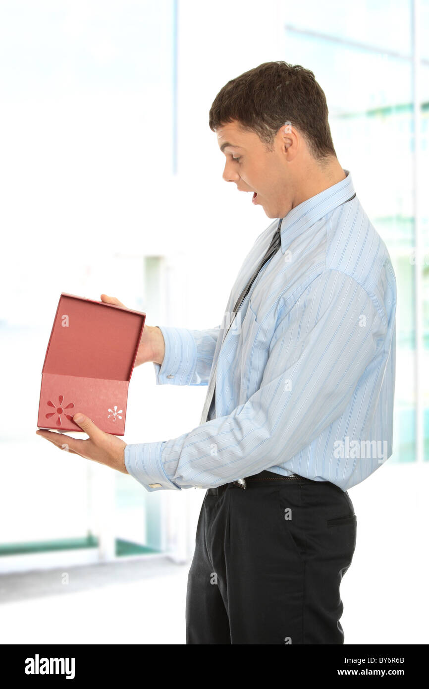 Business man opening a gift Stock Photo - Alamy