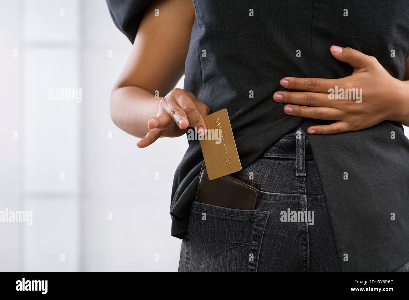 femlae hand pickpocketing gold credit card from businessman's pocket ...