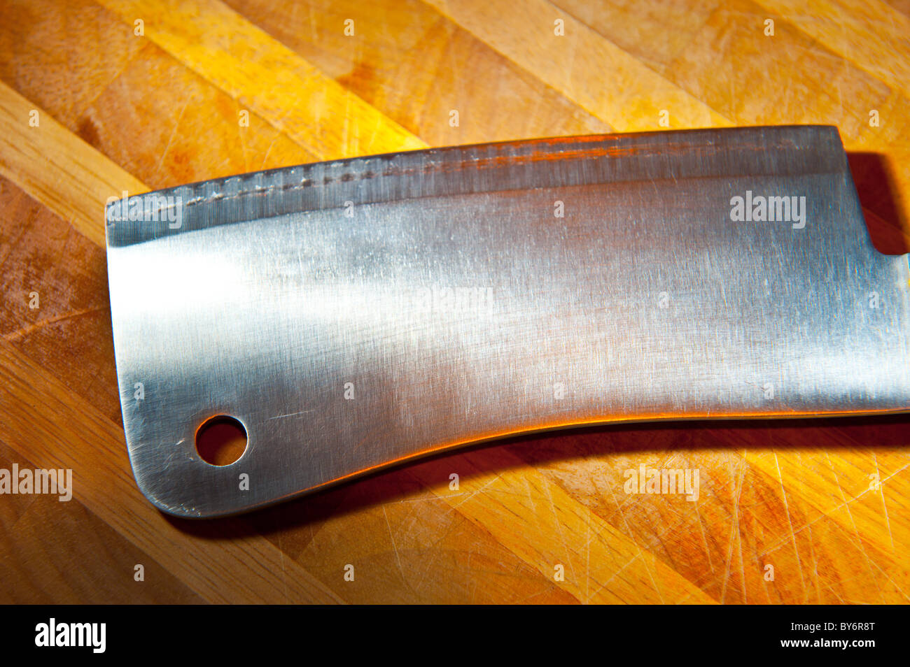 Shiny stainless steel meat cleaver on wooden chopping board Stock Photo ...