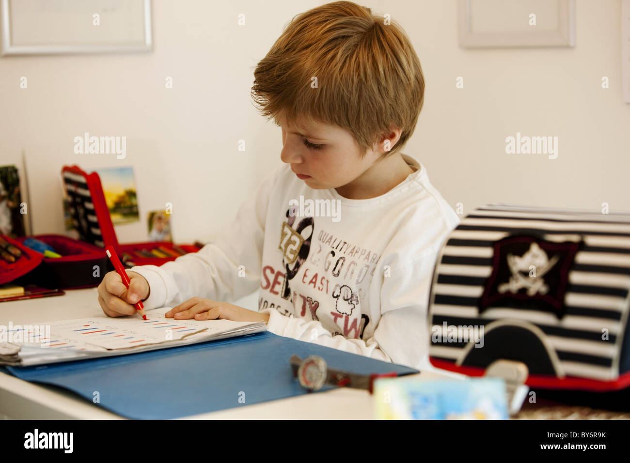 Boy (6 years) doing homework Stock Photo - Alamy