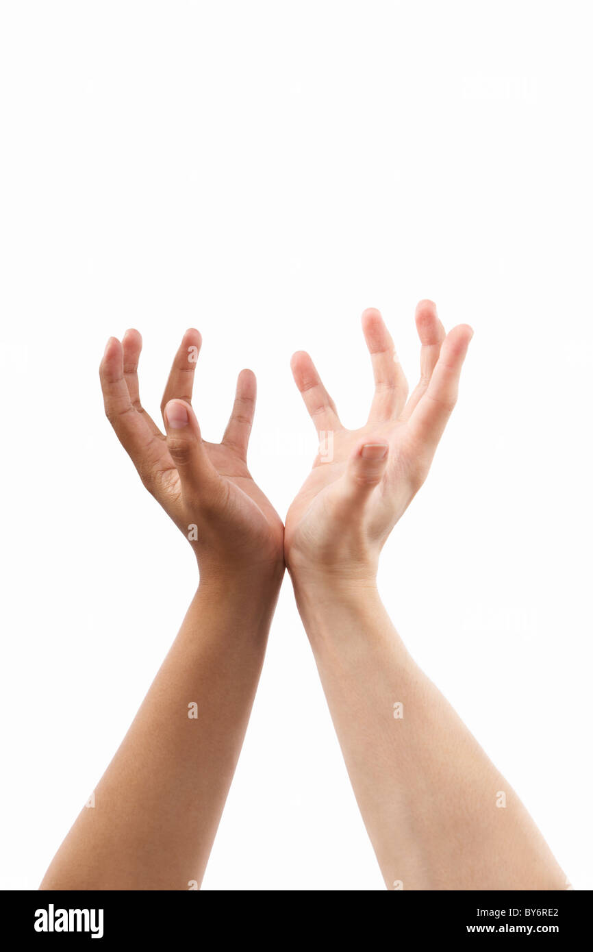 Supporting hand of different skin tone hand, against white background ...