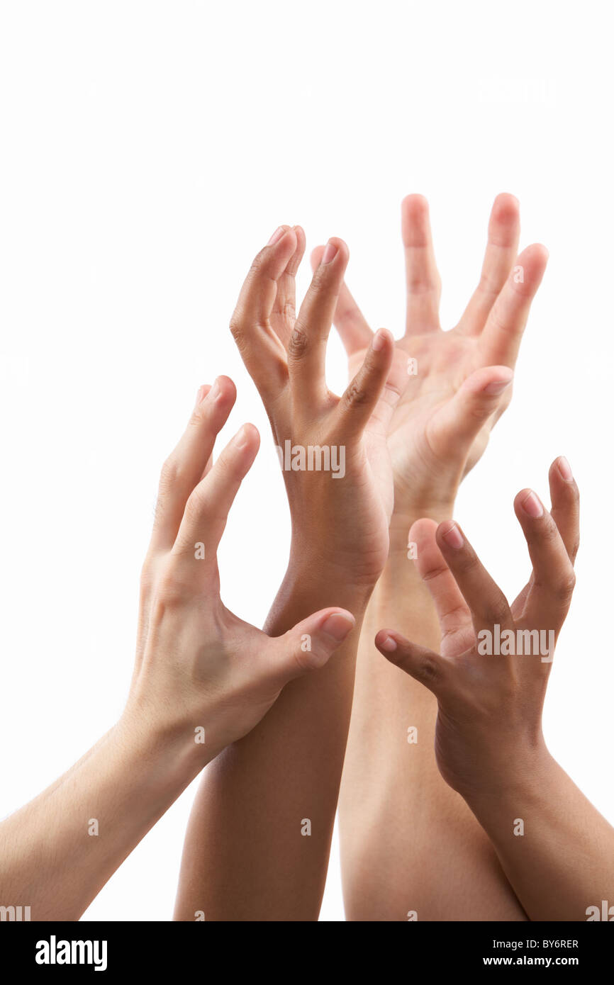 Reach out hand gesture from different skin tone hands, against white ...