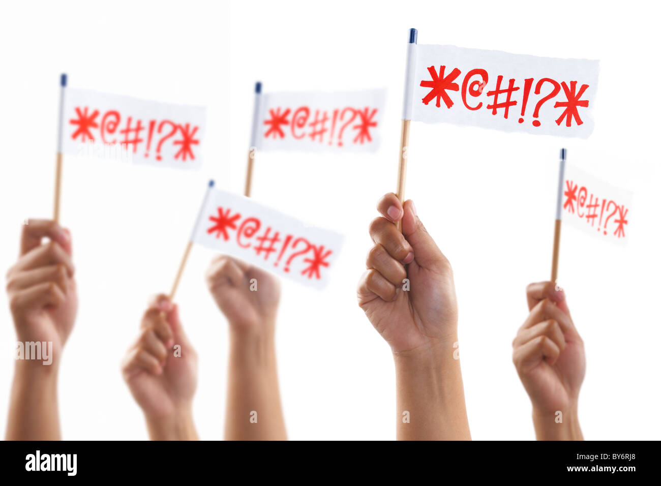Hands uprising and holding angry flag, shot aginst white background ...