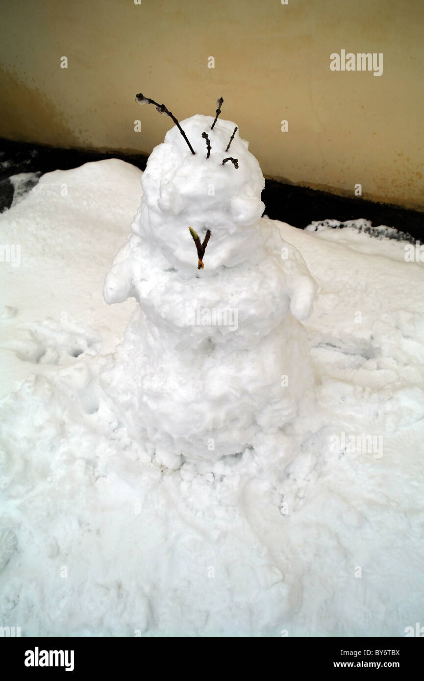 The snowman about a wall of the house in the winter, Moscow Region ...