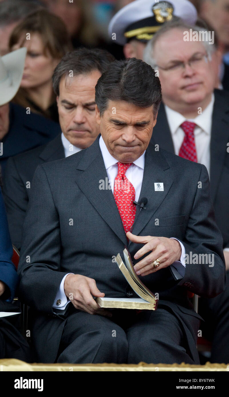 Texas Gov. Rick Perry looks at his family Bible prior to taking the ...
