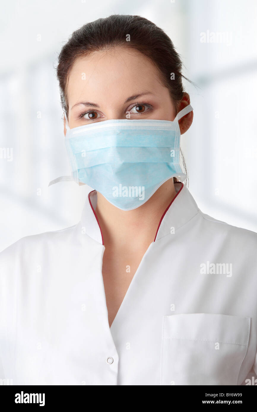 Young nurse in mask , isolated on white background Stock Photo - Alamy