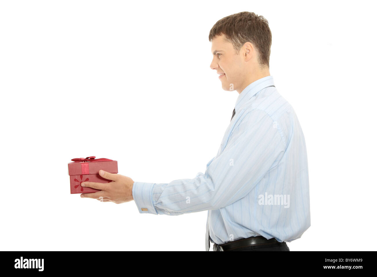Business man offering a gift over a white background Stock Photo - Alamy