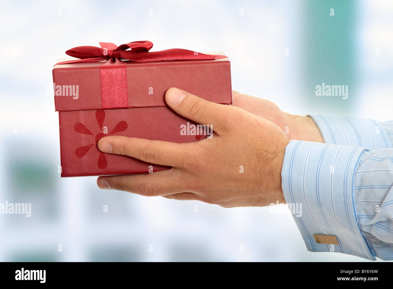 Business man offering a gift Stock Photo - Alamy