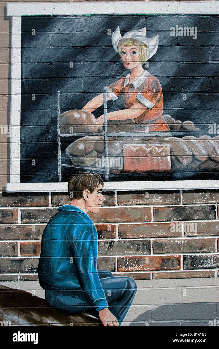 A mural of a woman baking bread in a window with a man outside. This ...