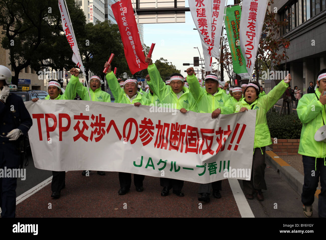 Japanese agricultural workers on protest march through Takamatsu ...