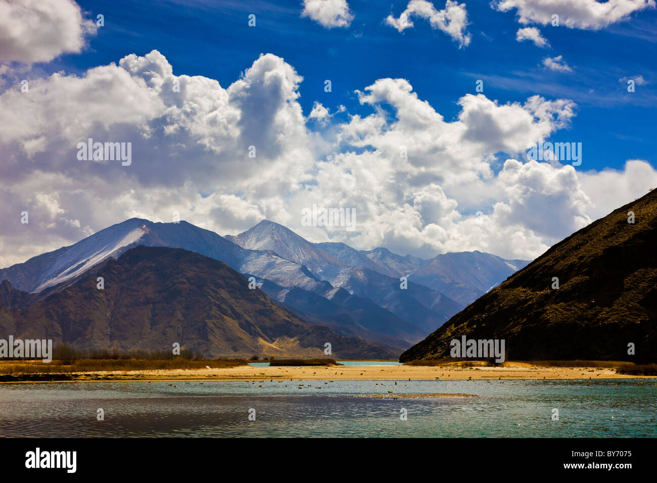 Mountains across Lhasa River near Nie Tang Buddha alongside the road ...