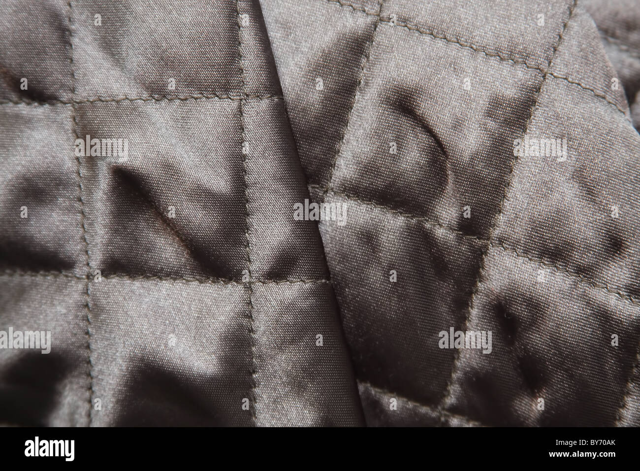 sliver gray quilted satin fabric Stock Photo - Alamy