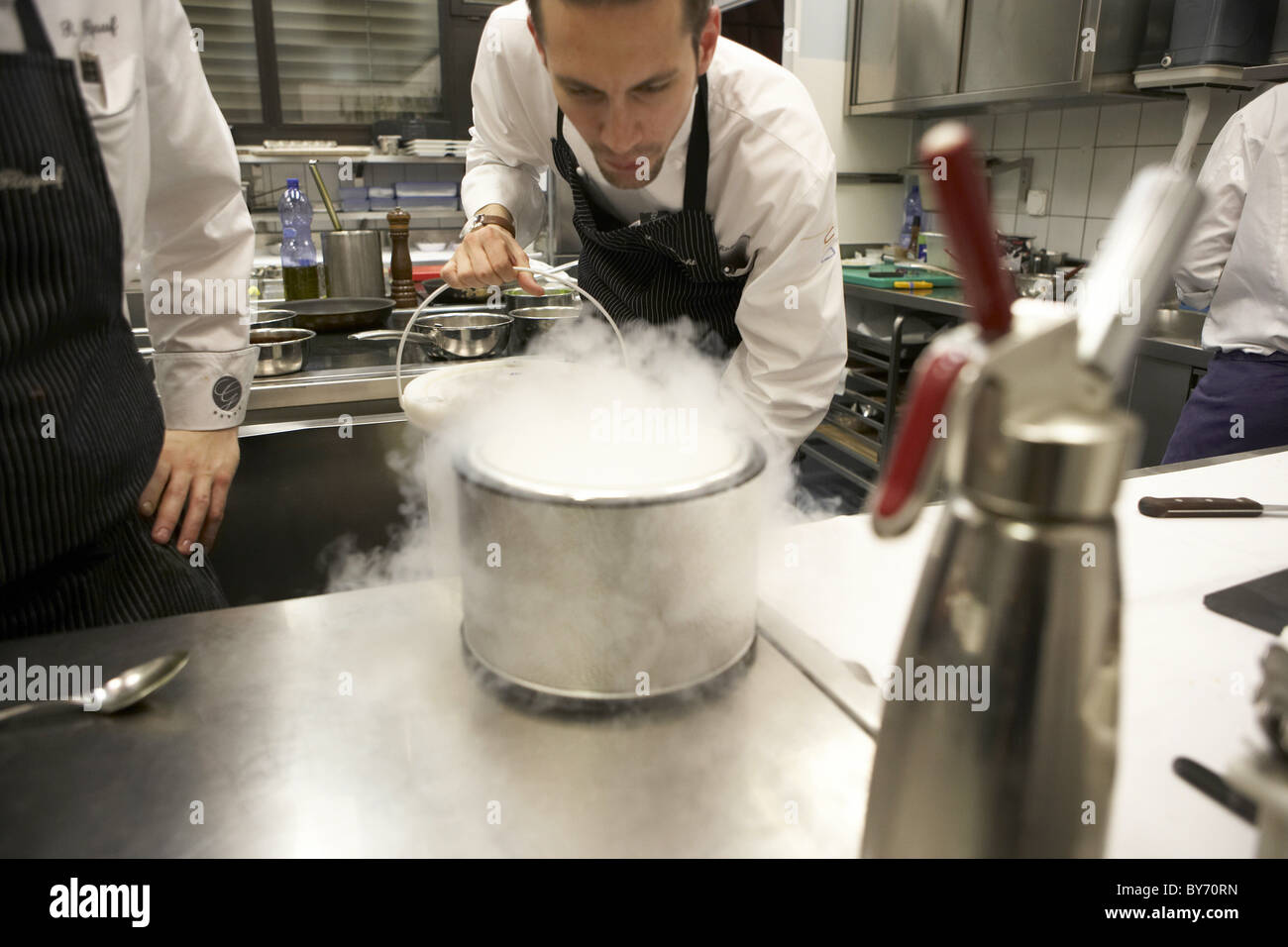 Man in the kitchen cooking in the Restaurant Ecco, Hotel Giardino ...